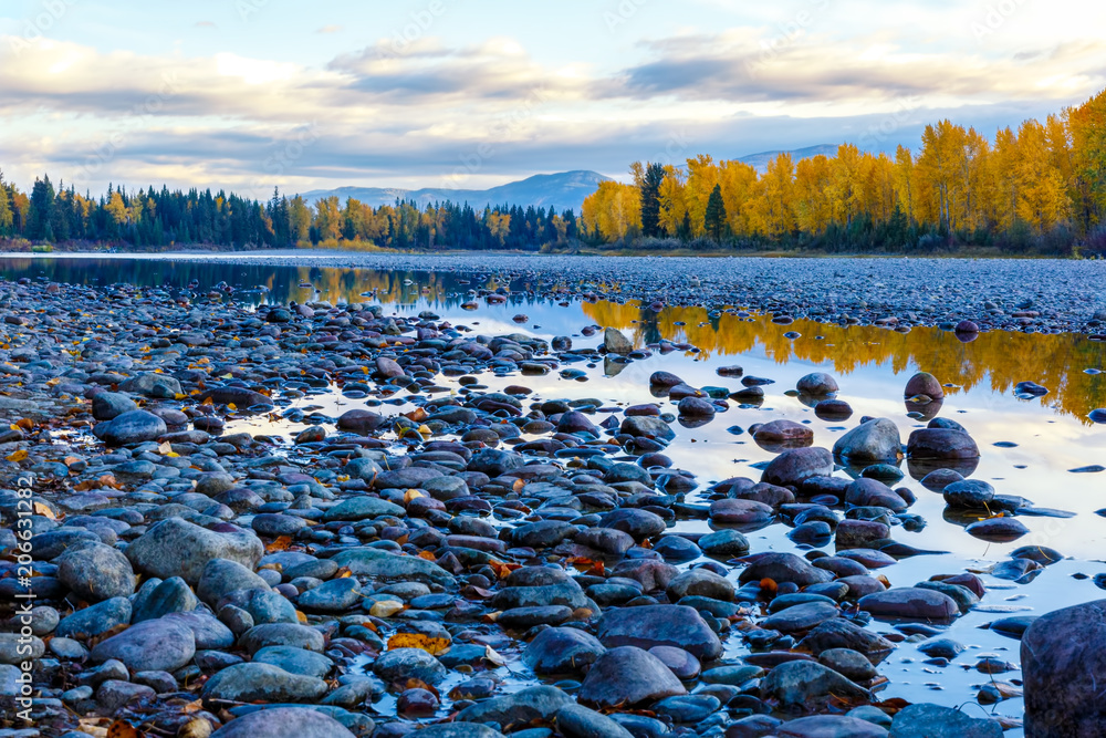 River rocks and color reflection on Flathead River, Montana in autumn ...