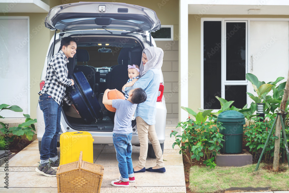 Young father with his family ready for holiday Stock Photo | Adobe Stock