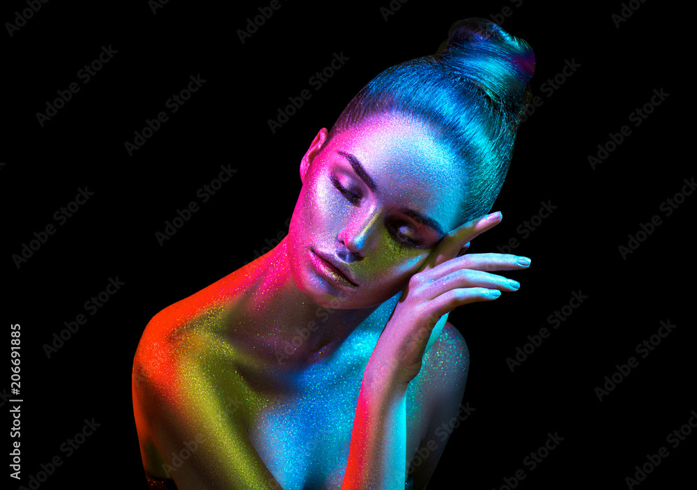 Fashion model woman in colorful bright sparkles and neon lights posing ...