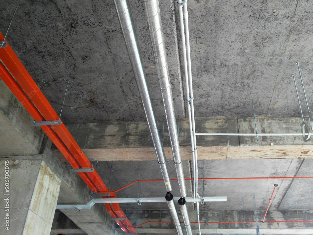 Foto de Electrical conduit, cable tray and aircond pipes as part of ...