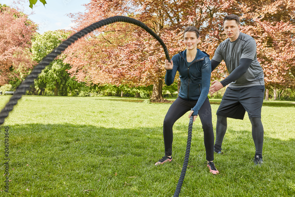 Personal training battle rope exercise Stock Photo | Adobe Stock