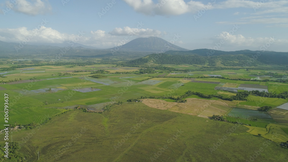 Mountain valley with farmland, rice terraces near mount Iriga. Aerial ...