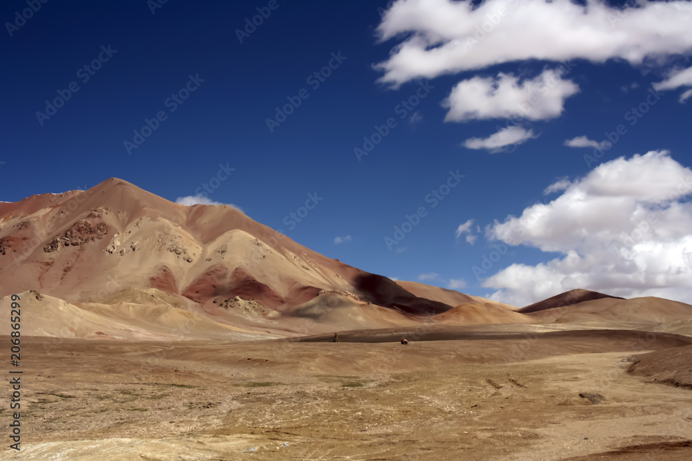 mountain landscape with an alone wayfarer taking shelter in a small ...