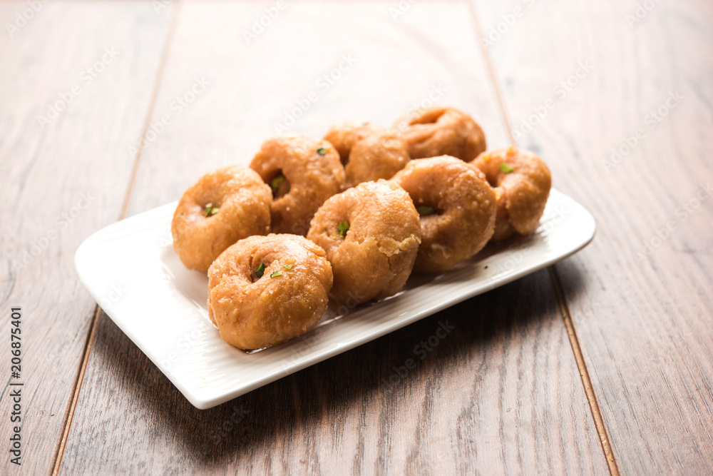 Balushahi sweet food served in a white or golden plate over moody ...