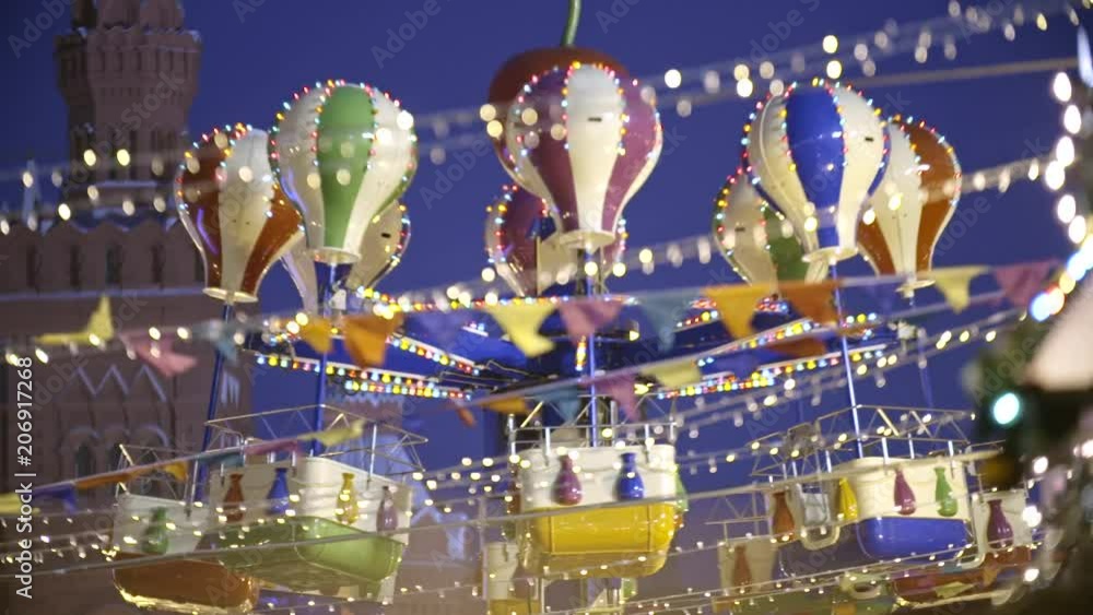 Illuminated retro carousel at night. Merry-Go-Round video taken on the ...