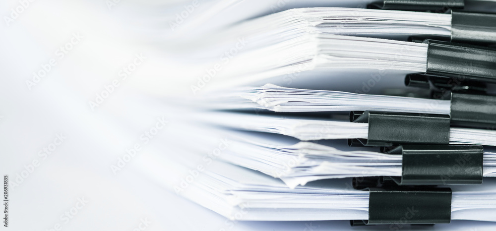 extreamely close up report paper stacking of office working document ...