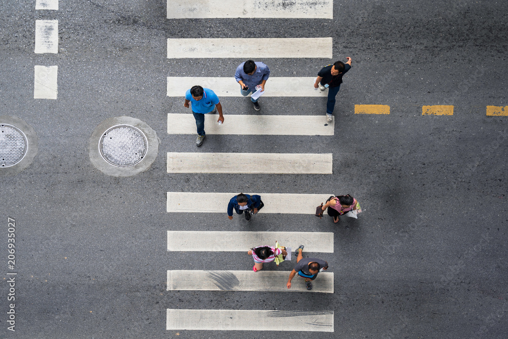 Aerial photo top view of people walk on street in the city over ...