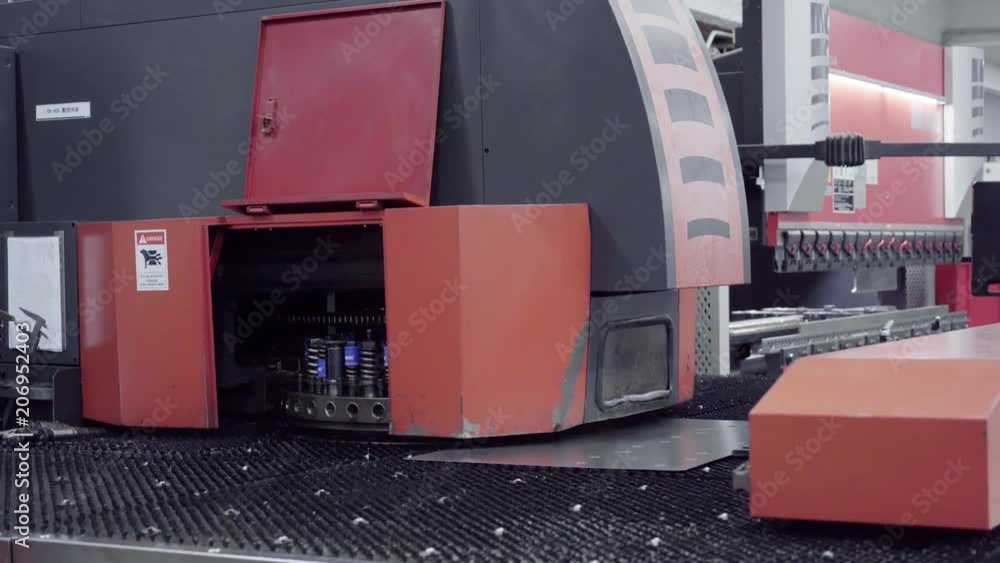a special automatic press for punching tin sheets. it can completely ...