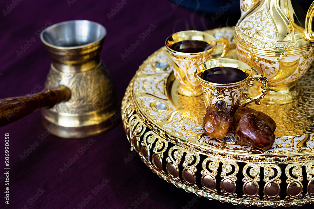 Still life with traditional golden arabic coffee set with dallah Stock ...