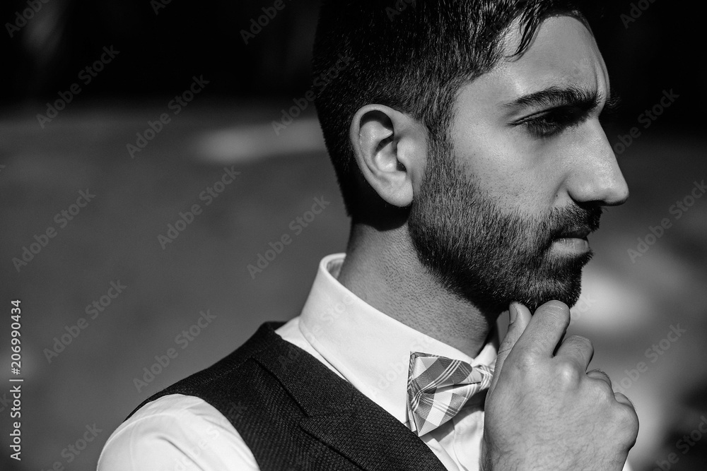 Handsome Hindu groom in blue suit poses outside in a green park Stock ...