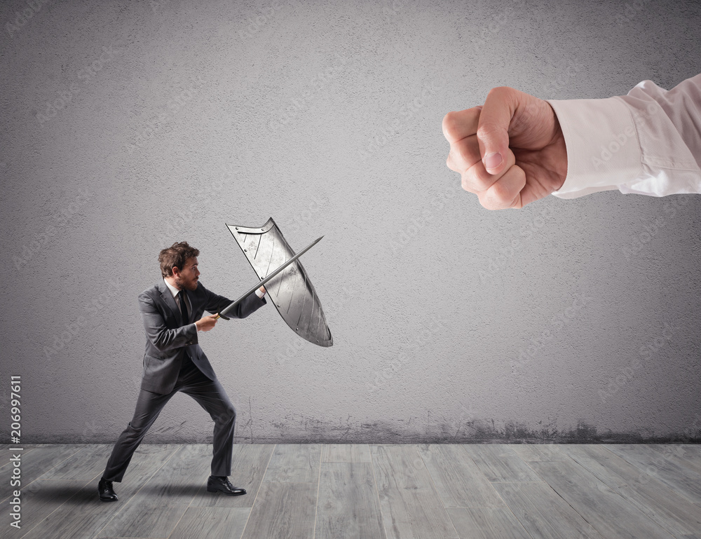 Little business man challenges big problems fighting with shield and ...