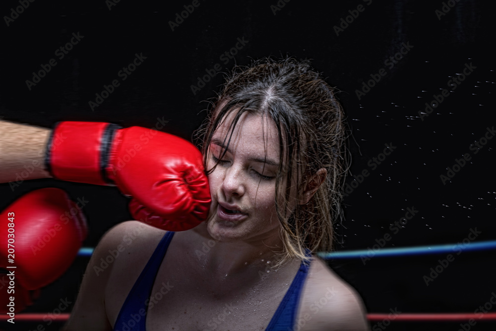 Woman gets hit in a boxing match Stock Photo | Adobe Stock