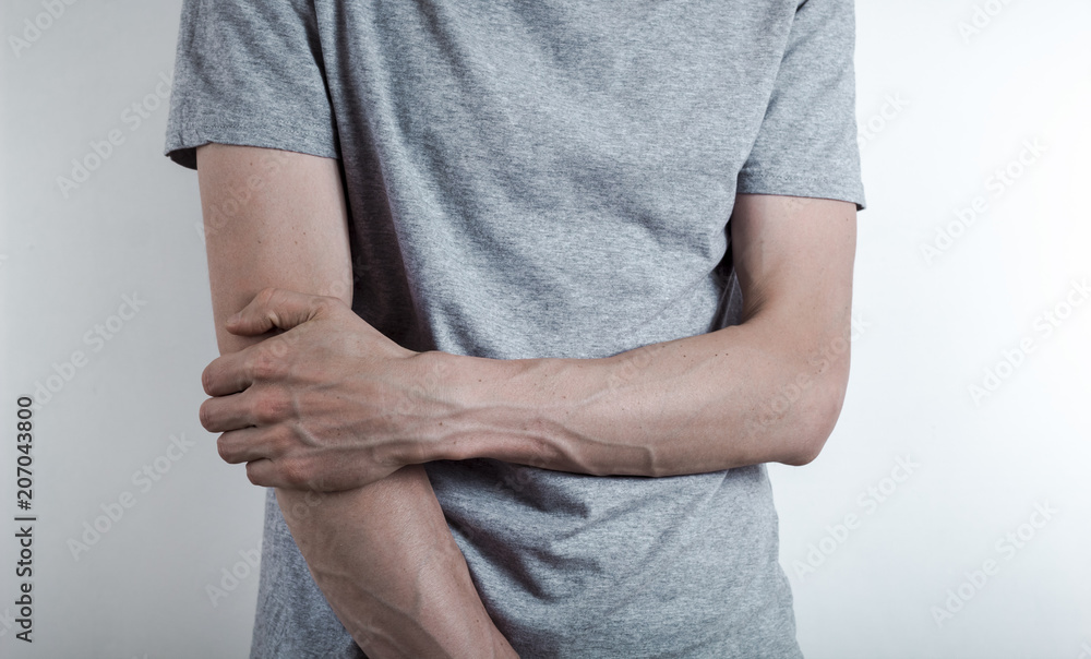 Injury of the elbow joint. Arthritis. Stock Photo | Adobe Stock