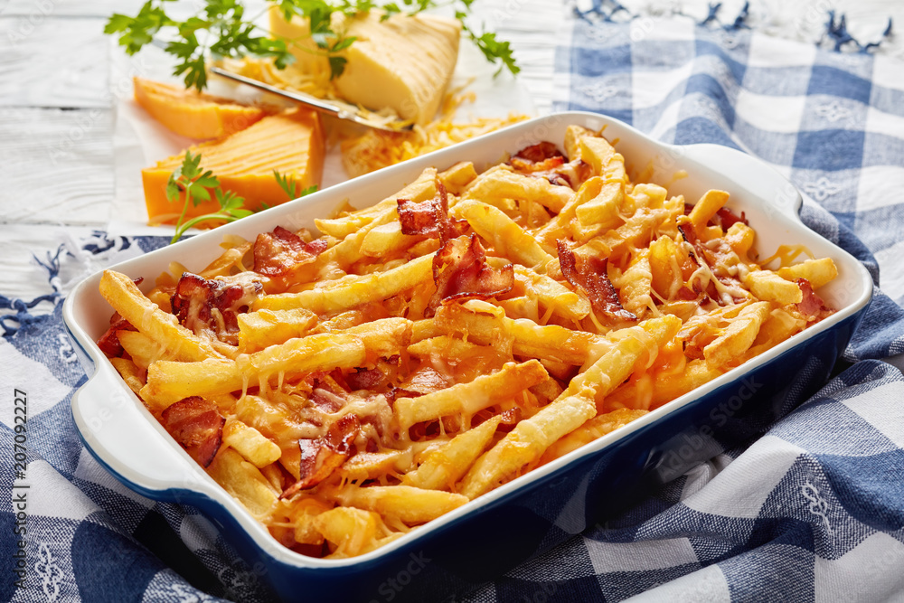 aussie fries with bacon and melted cheese Stock Photo | Adobe Stock