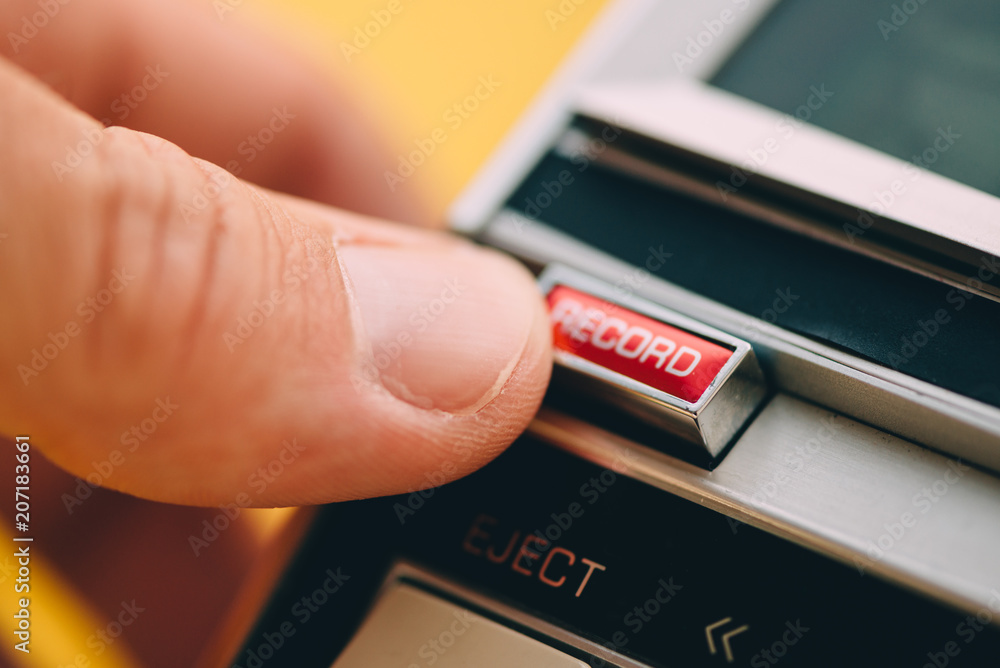 Finger pushing Record button on vintage audio cassette player Stock ...