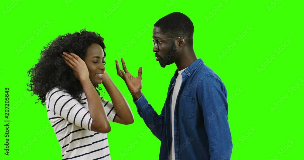 African American young man screaming and shouting emotionally on his ...