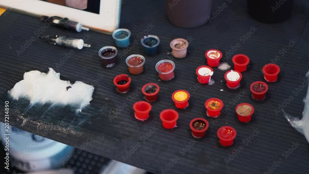 A special paint for doing the tattoo. Preparation of master tattoo ...