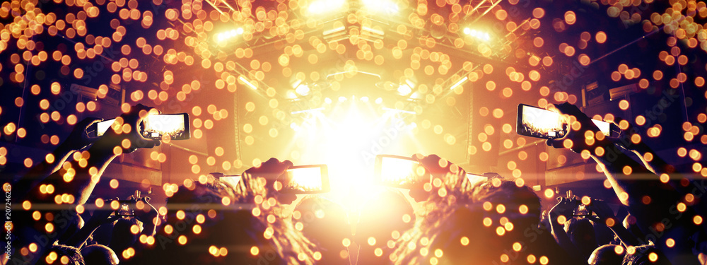 Concert venue crowded with clapping fans. Distress effects and lens ...