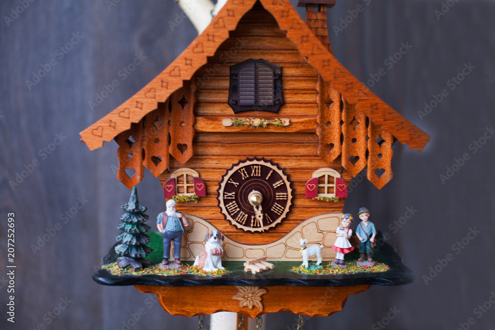 Traditional handmade colorful wooden cuckoo clocks with birds that ...