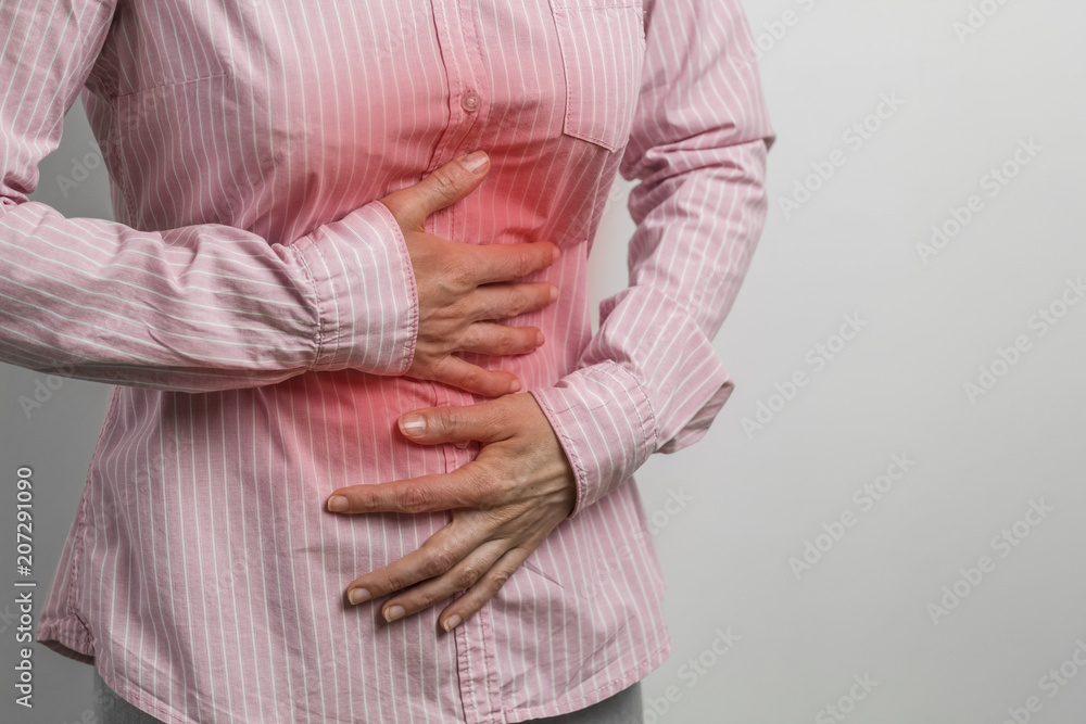 Abdominal pain. Heartburn. Diarrhea. Stock Photo | Adobe Stock