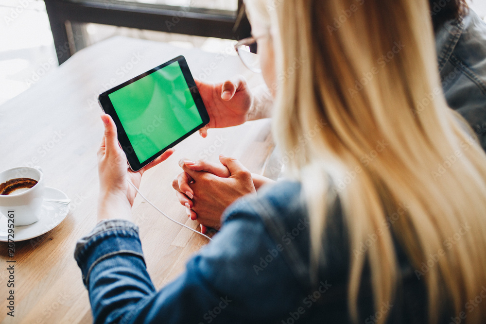 Mock up - green screen on tablet device, Young couple watching together ...