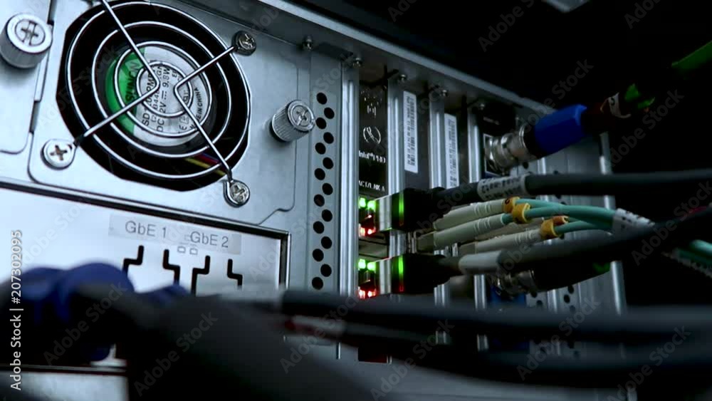 Working Ethernet switch in data center room, connecting computers together. Working Ethernet ...