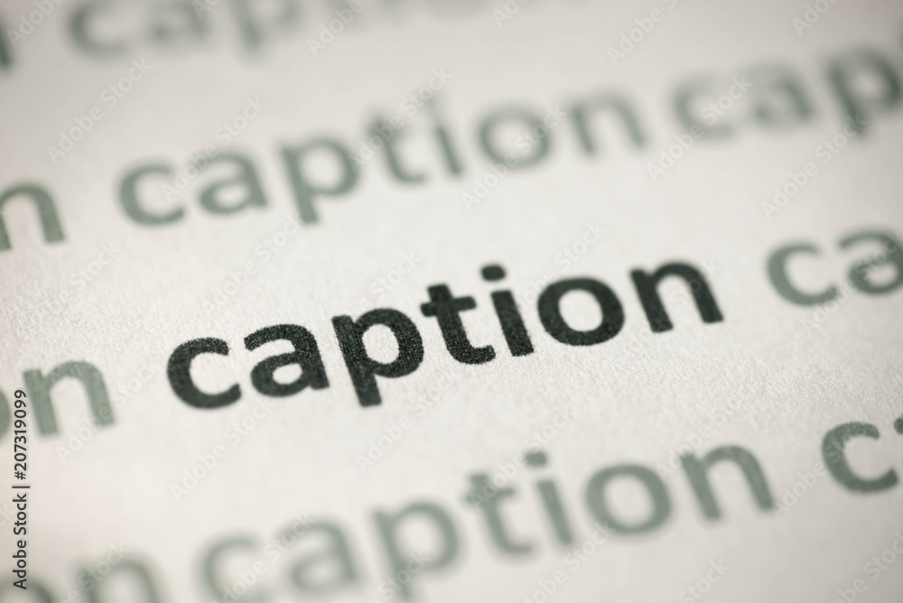 word caption printed on paper macro Stock Photo | Adobe Stock
