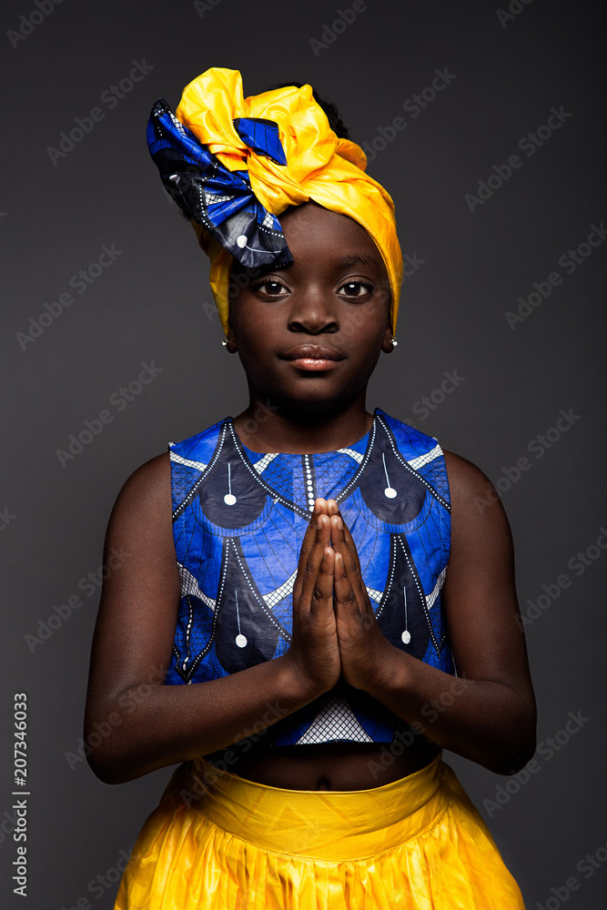 Girl posing in traditional clothing Stock Photo | Adobe Stock