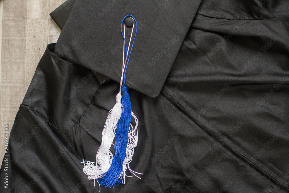 Graduation Cap and Gown with Tassels Stock Photo | Adobe Stock