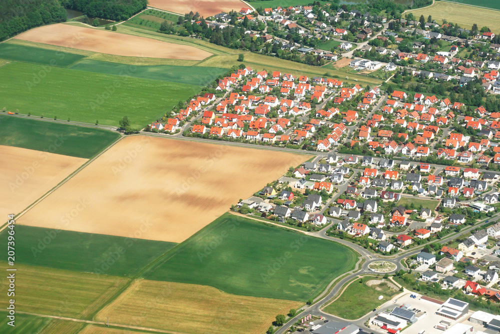 Aerial view of the German suburbs. Private houses and agricultural ...