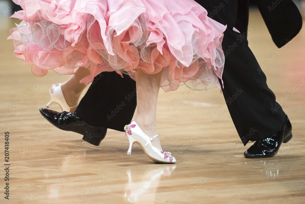 Woman's feet between man's feet dancing on parquet floor Stock Photo ...