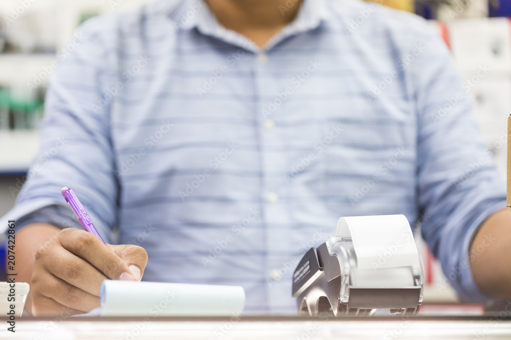 Business concept of man record payment information and calculate bills ...