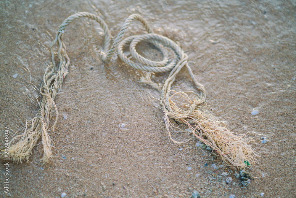 rope tie at sand beach ocean wave vintage color tone Stock Photo ...