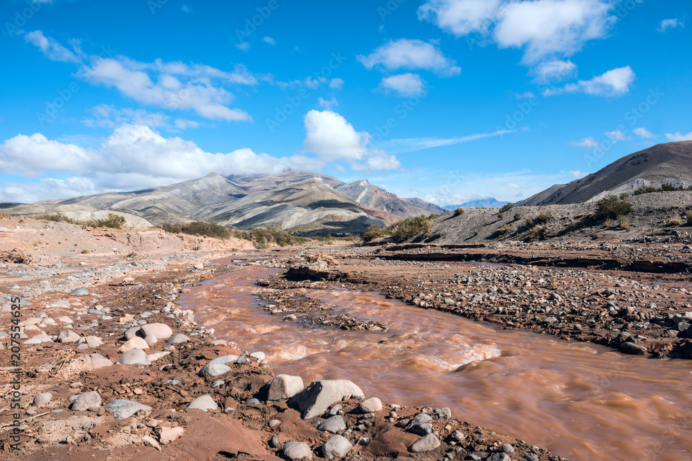 Layered sedimentary rocks in the colorful valley of the Rio Grande ...