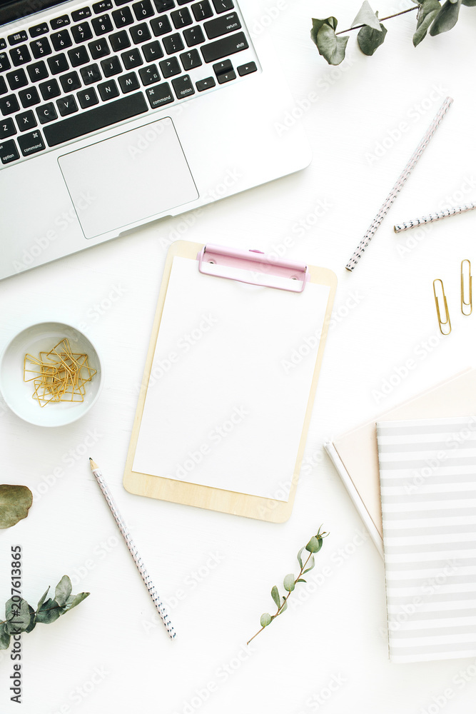 Flat lay office workspace with blank clipboard, laptop and stationery ...