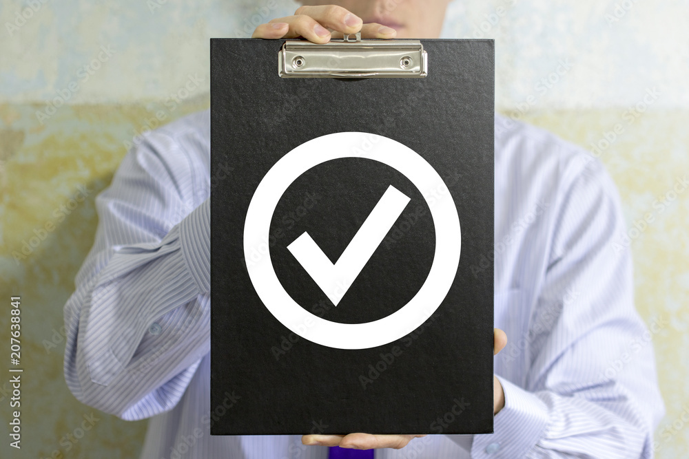 Businessman offers a checklist with check mark. Clipboard and checkmark ...