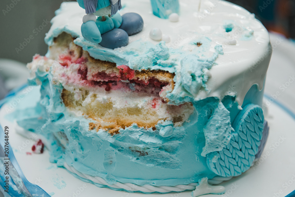 Broken child cake. Kid's feet near the cake. Cute little boy eating his ...