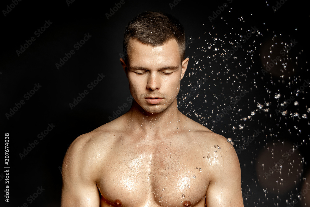 Hydrated male portrait in water splash and drops Stock Photo | Adobe Stock
