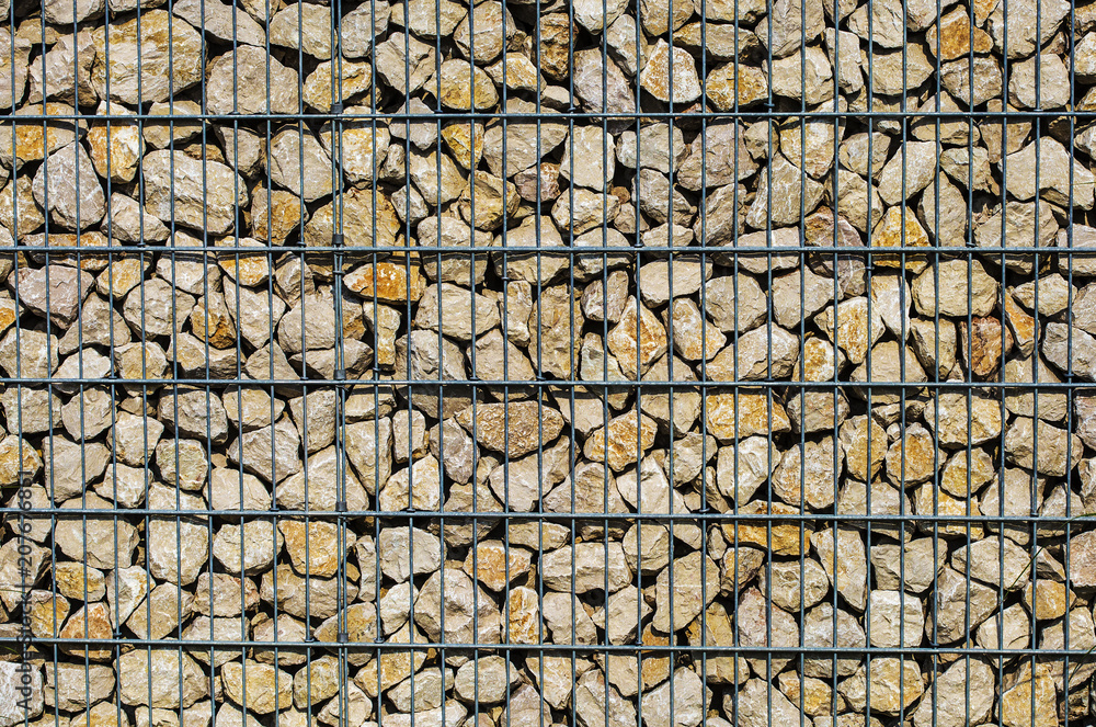 Detail of gabion wall filled with stones Stock Photo | Adobe Stock