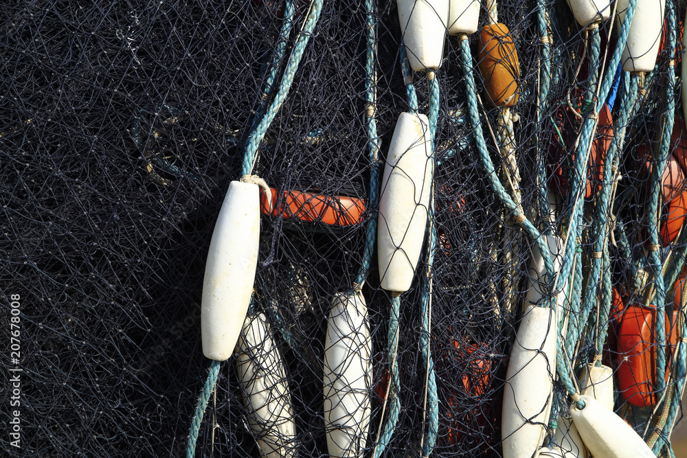 Sea fishing nets drying on railings at filey bay england UK Stock Photo ...