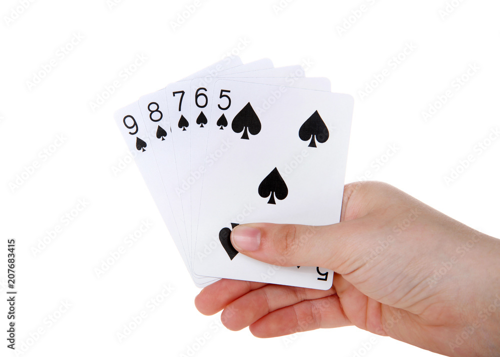 Young female hand holding Playing cards, a straight flush. A straight ...