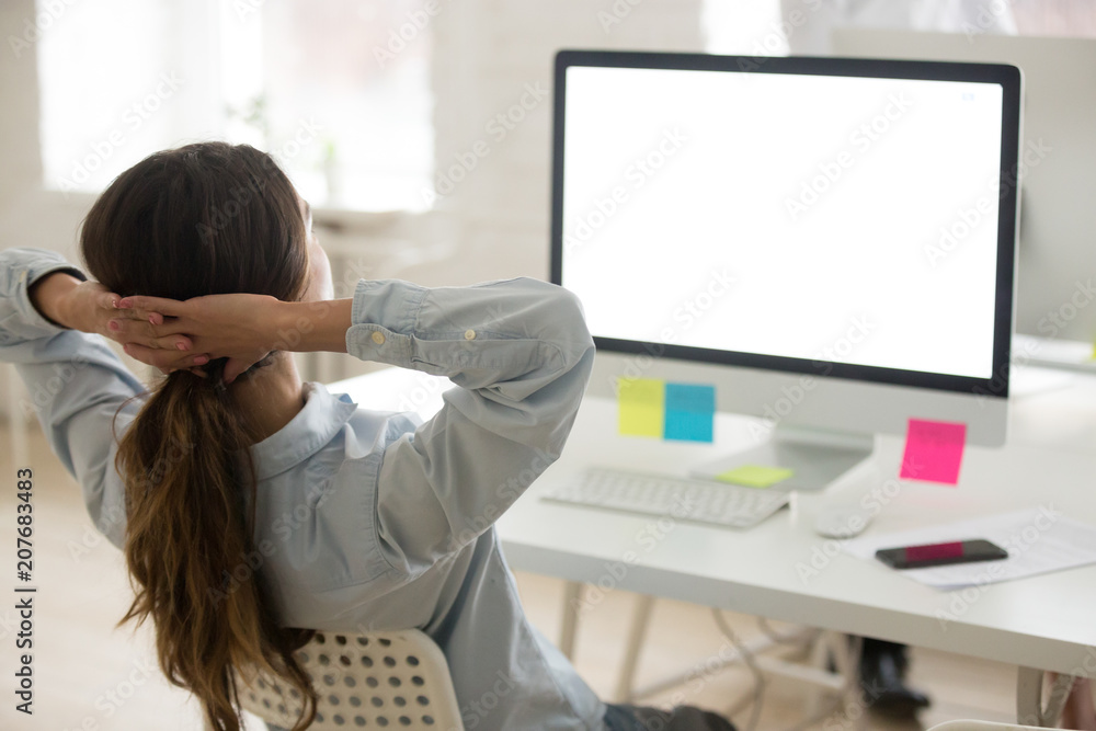 Back view of worker relaxing leaning back in chair, resting after ...