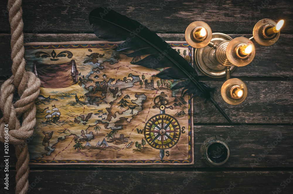Pirate treasure map, burning candle, rope knot, feather pen and inkwell ...