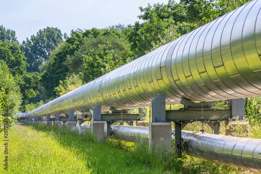 Huge metal gas pipeline transporting gas Stock Photo | Adobe Stock