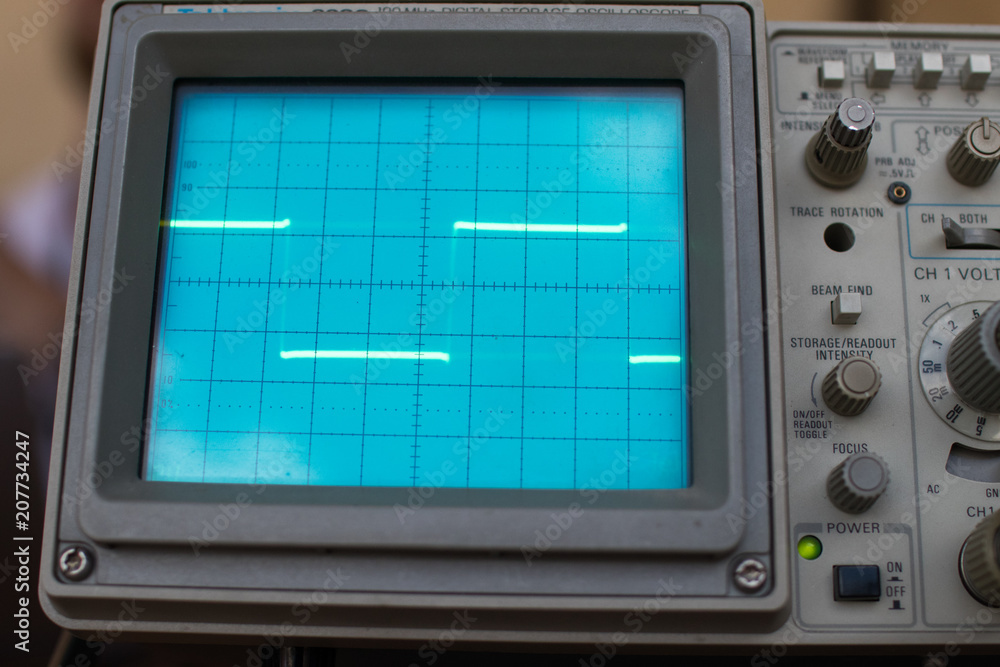 Oscilloscope signals a square wave on the display. instrument for measuring electrical signals ...