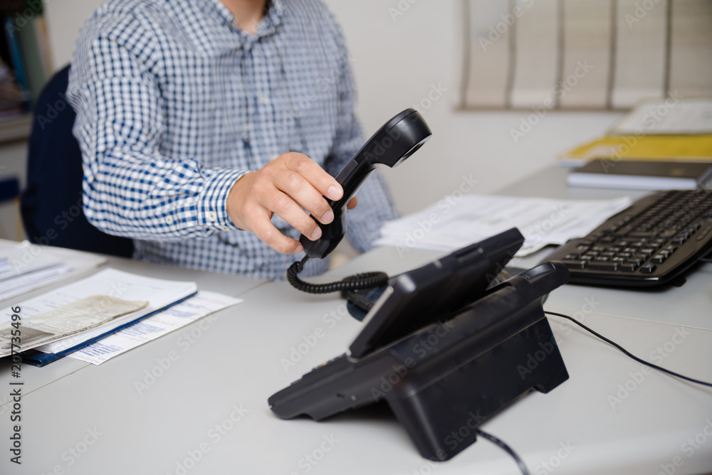 Closeup on busy office phone workplace, light table window. Modern ...