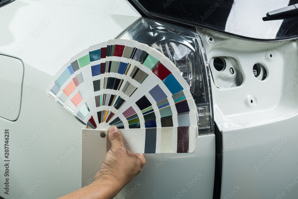 Poster Auto body repair series: Comparing car color with color chart ...