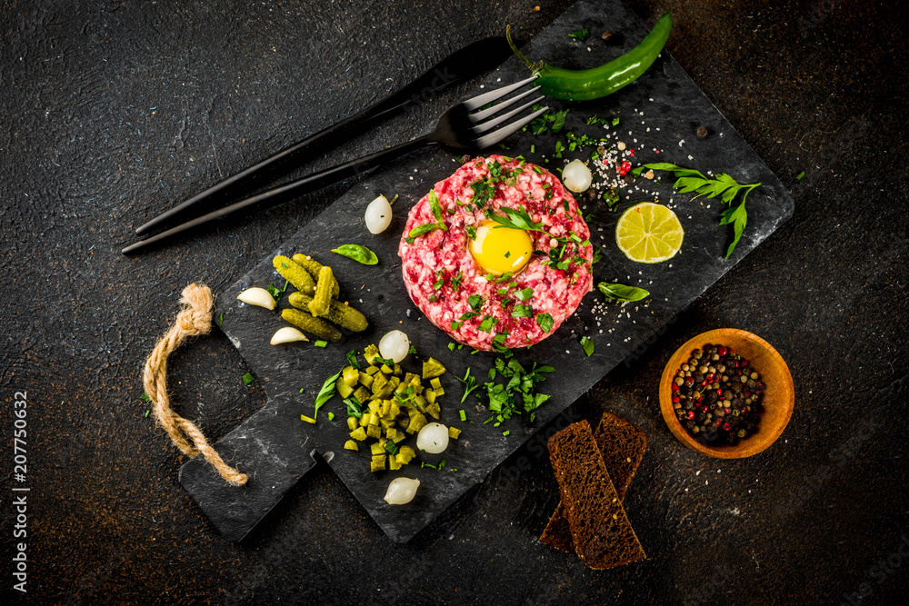 French cuisine, beef steak tartare with raw quail egg yolk, pickled ...