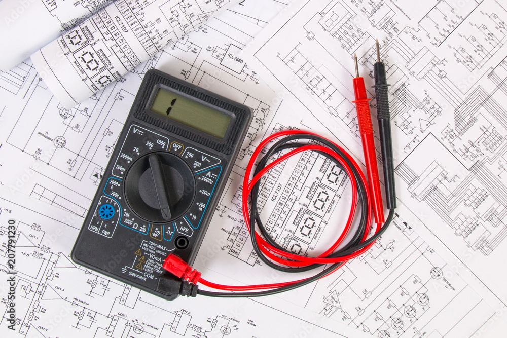 Electrical engineering drawings and digital multimeter. Stock Photo ...
