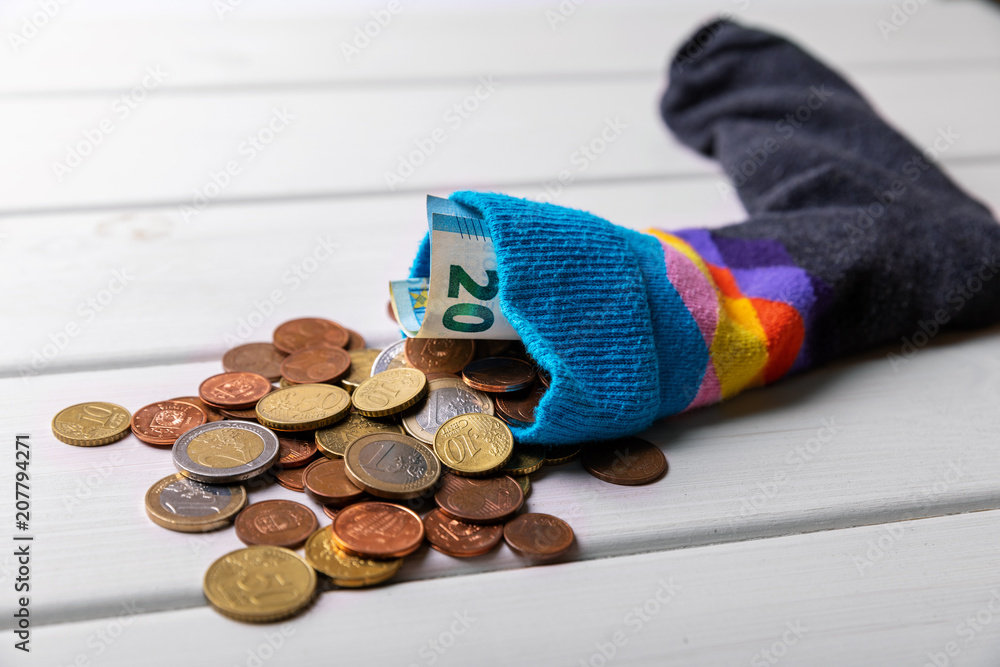 sock full with euro money. savings and hiding concept Stock Photo ...